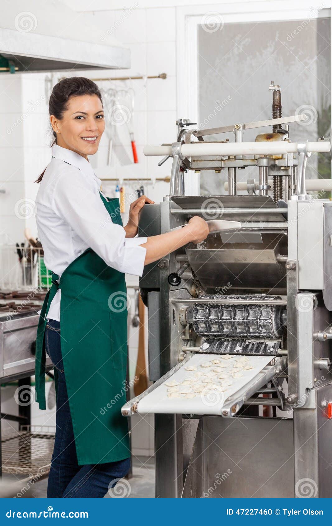 Smiling Chef Processing Ravioli Pasta in Machine Stock Photo - Image of ...
