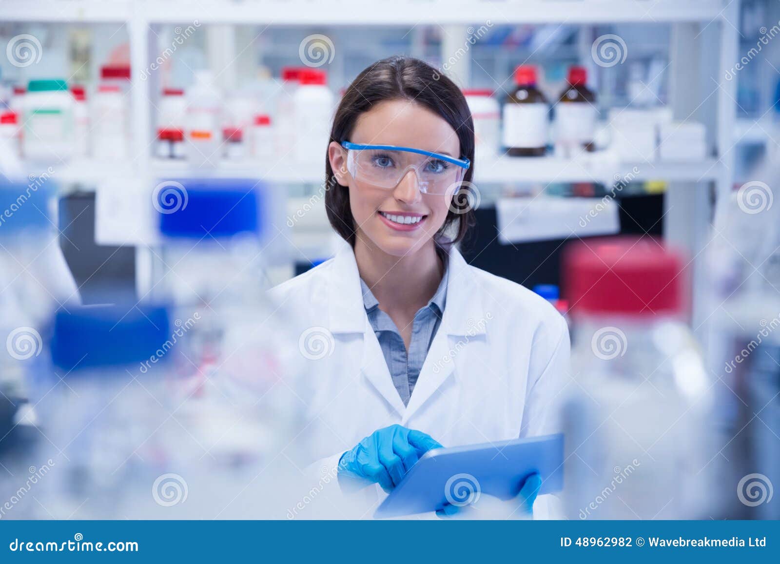 Smiling Chemist Wearing Safety Glasses and Using Tablet Pc Stock Photo ...