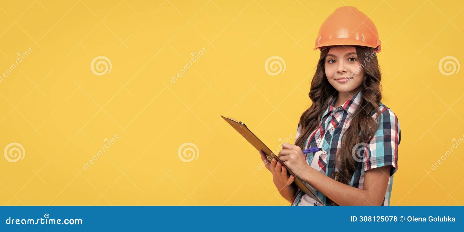 Smiling Child in Construction Helmet Making Notes in Clipboard ...