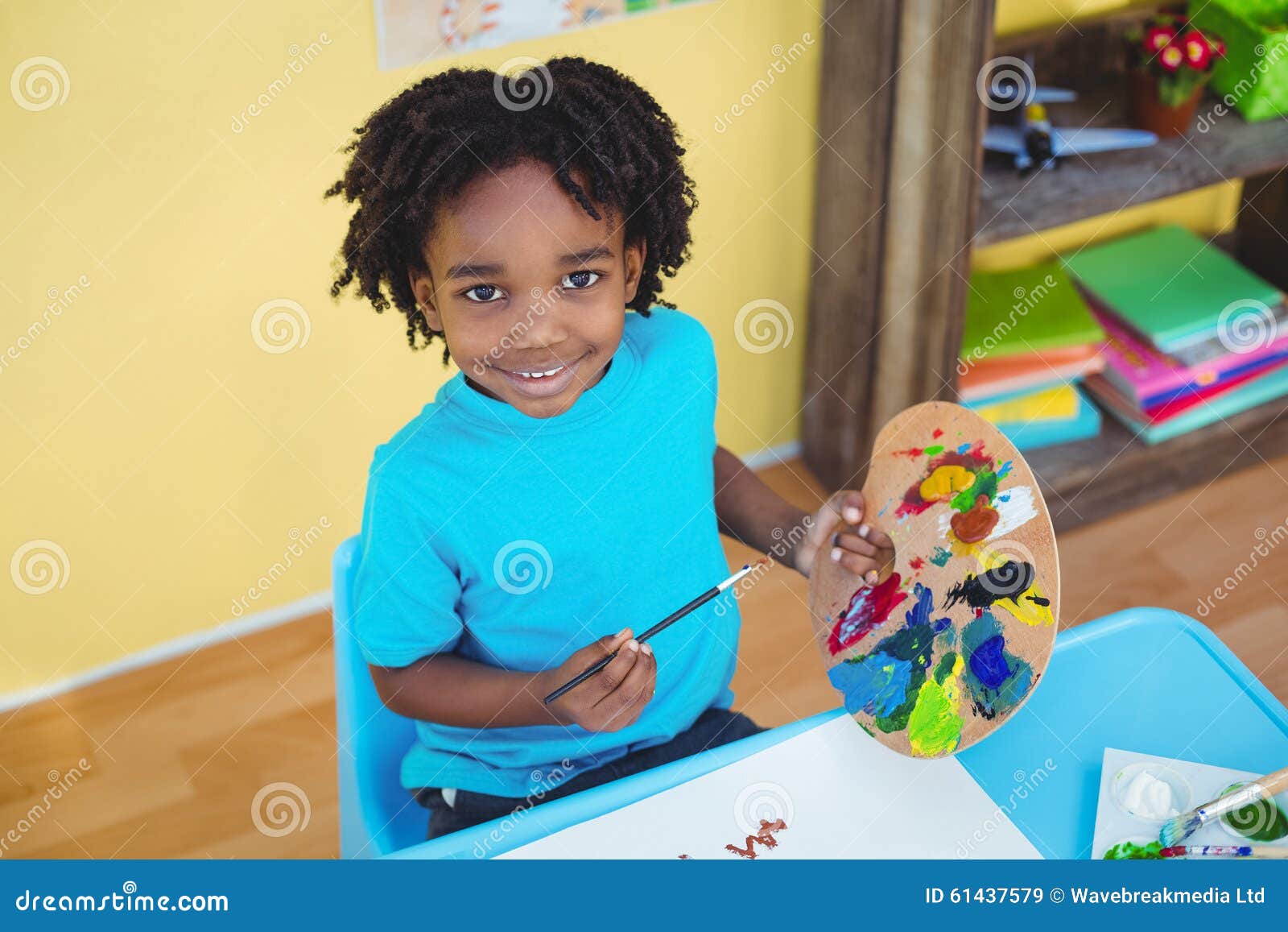 Smiling Child Creating a Picture Stock Image - Image of table, toys ...
