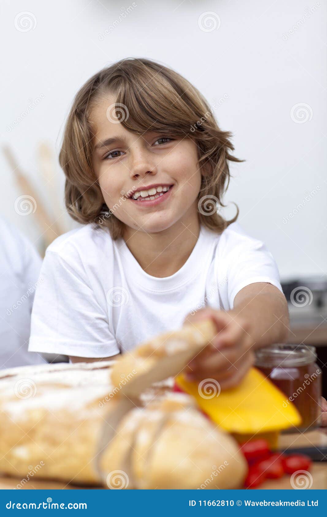 Smiling child eating bread stock photo. Image of meal - 11662810