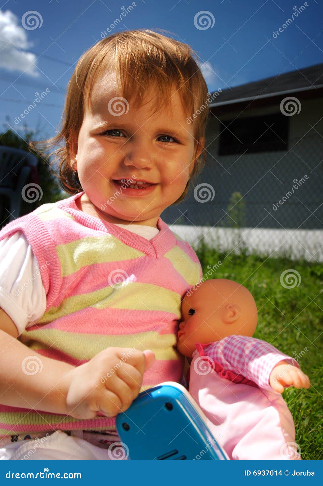 Smiling Child with Her Toys Outdoor Stock Photo - Image of cute, grass ...