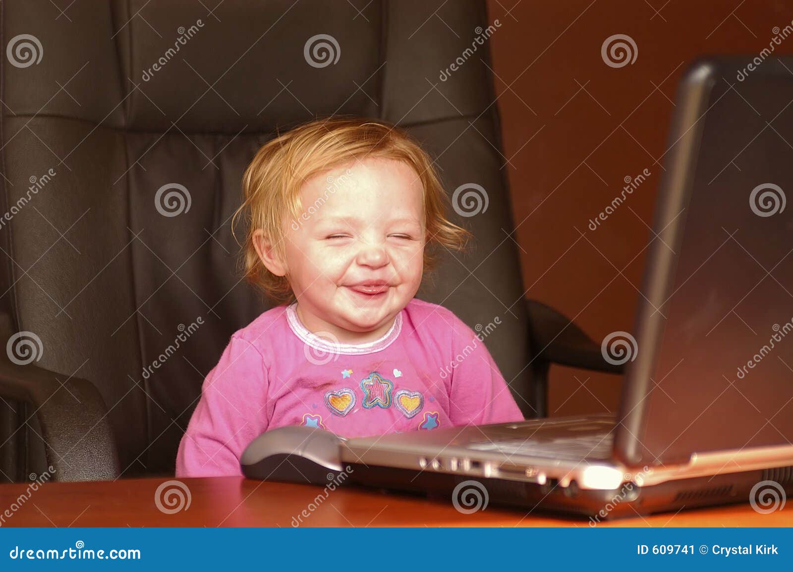 Smiling child with laptop stock image. Image of laughs - 609741