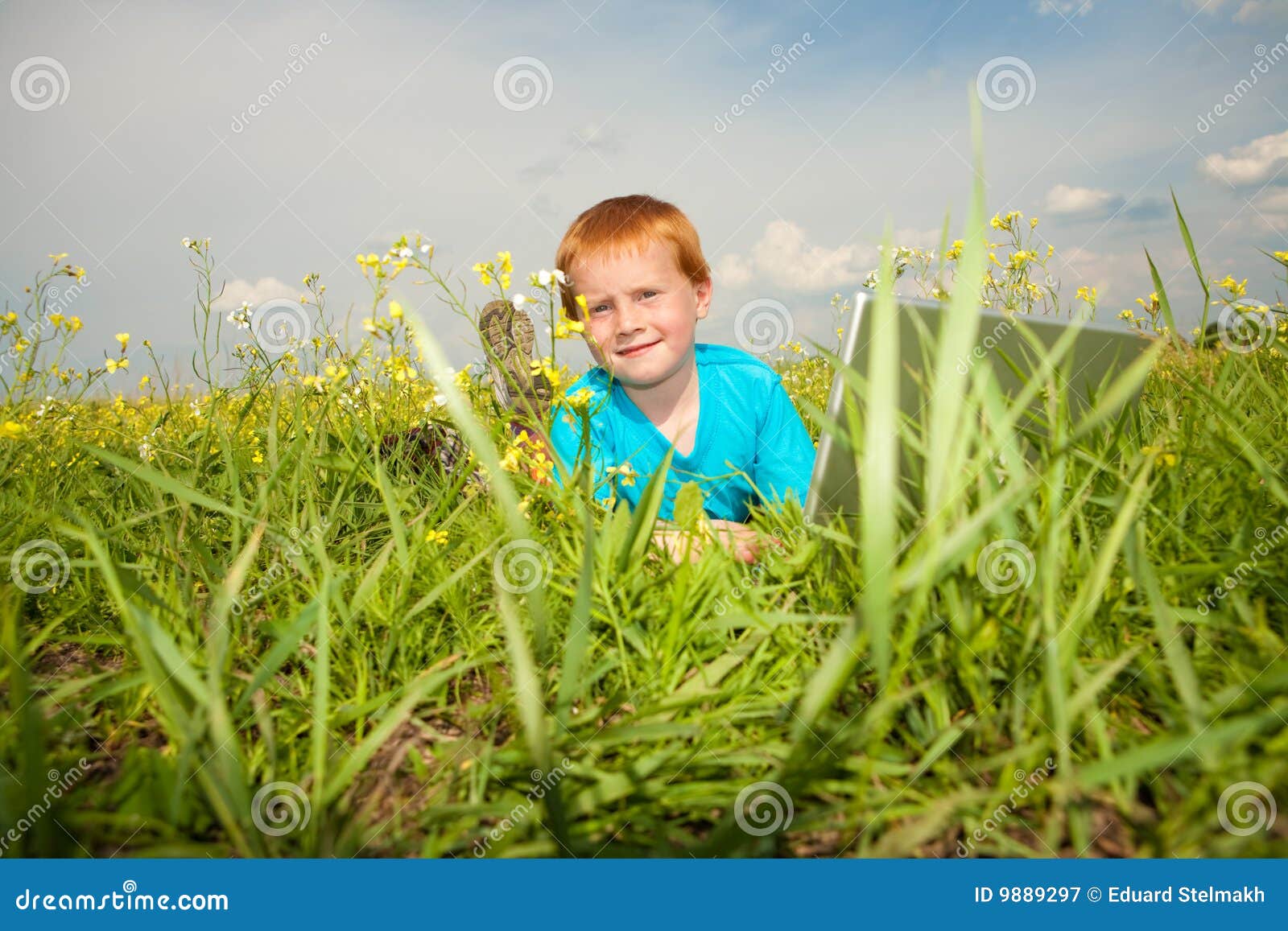 Smiling Child with Laptop Computer on Meadow Stock Image - Image of ...