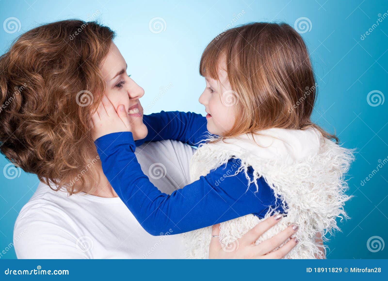 Smiling Child and Mom Embracing Stock Image - Image of curious ...