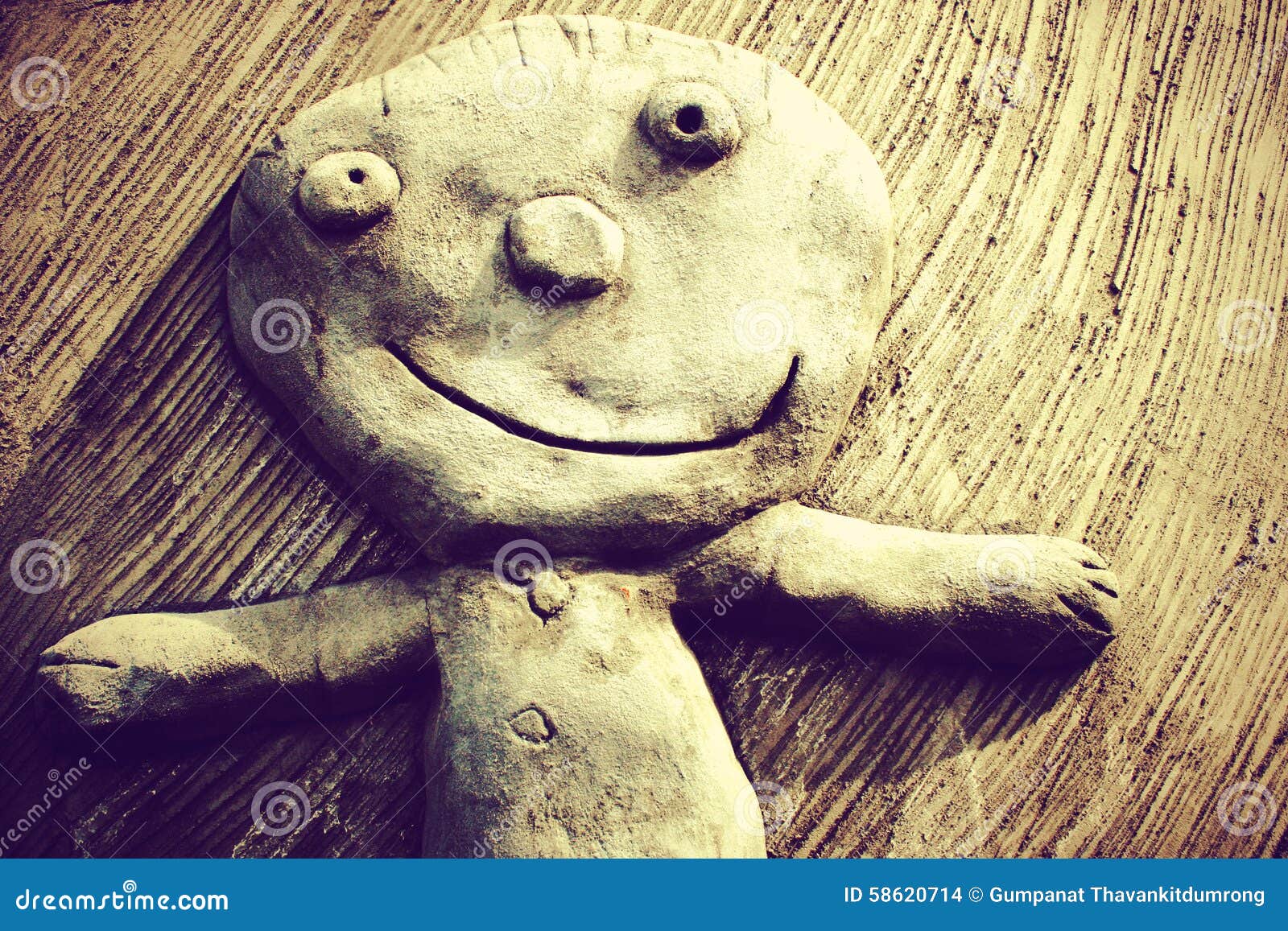 Smiling Child Sculpture on the Wall Stock Photo - Image of floral ...