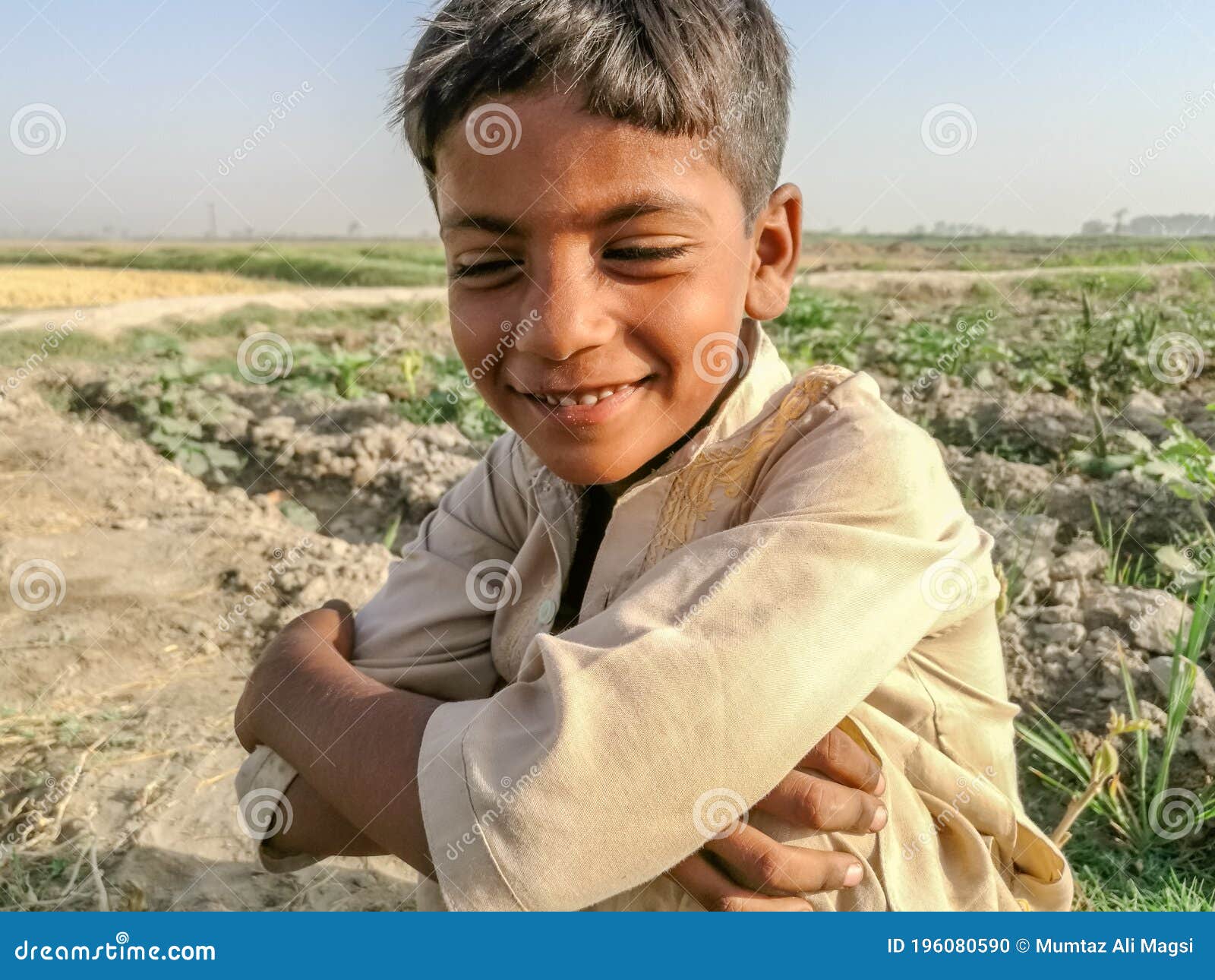 Smiling Child Sitting in the Fields Stock Photo - Image of benefit ...