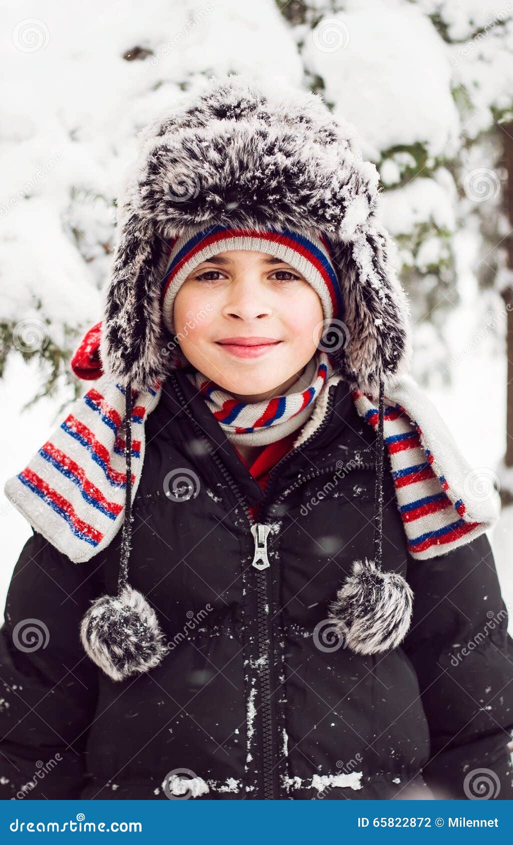 Smiling child in snowy day stock photo. Image of patio - 65822872