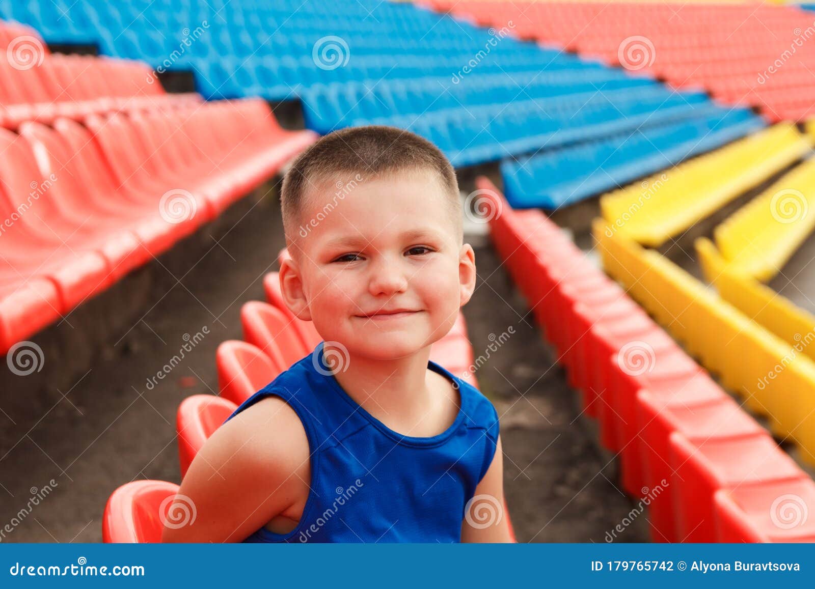 Smiling Child at the Sports Stadium Stock Photo - Image of athlete ...