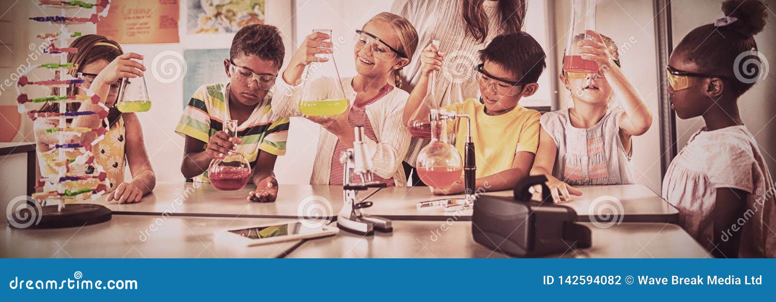 Smiling Children Doing Science Project Stock Photo - Image of asian ...