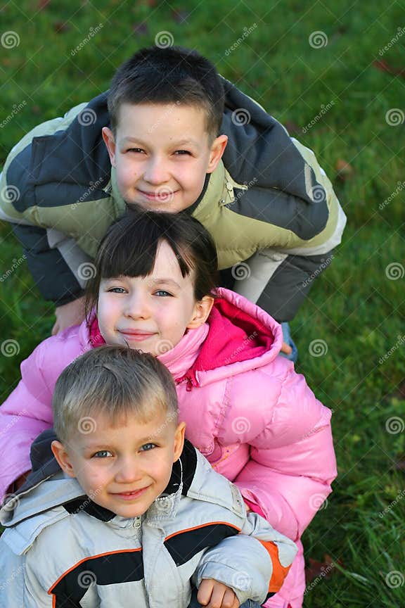 Smiling Children in a Field Stock Photo - Image of attractive ...
