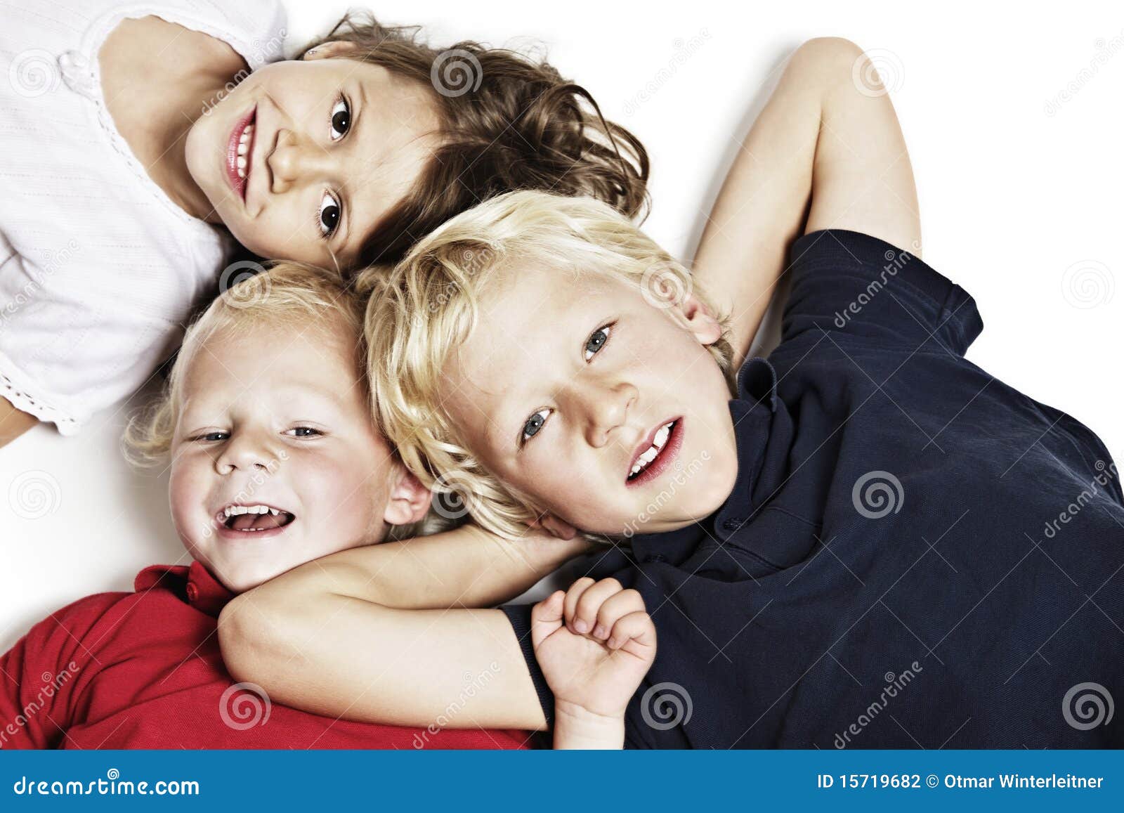 Smiling Children on Floor Looking Up Stock Photo - Image of happy ...
