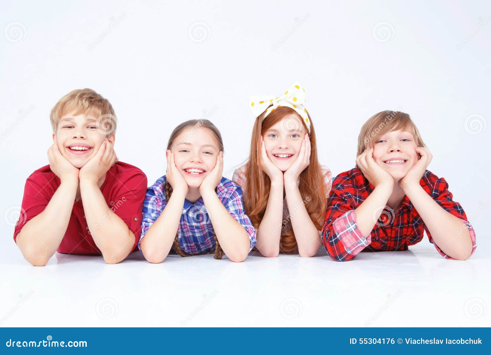 Smiling Children Lying on the Floor in Raw Stock Photo - Image of ...