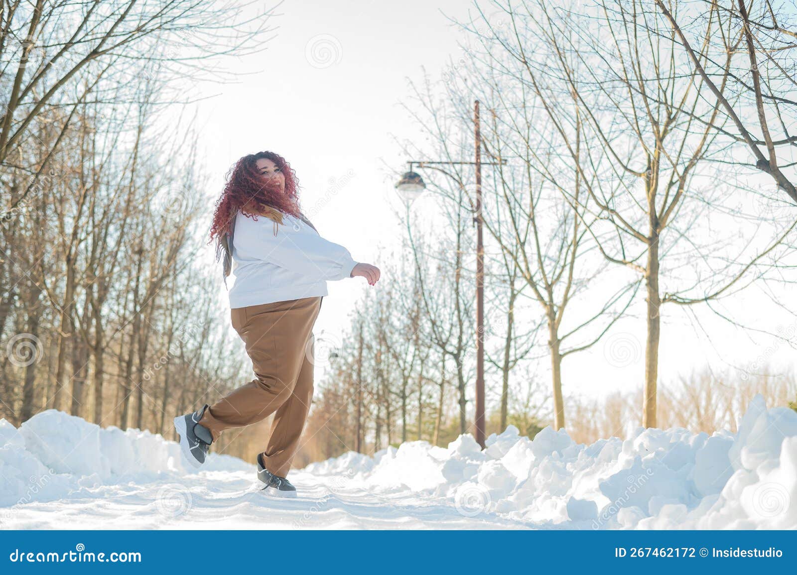 Smiling Chubby Redhead Woman Running in Park in Winter. Stock Photo ...