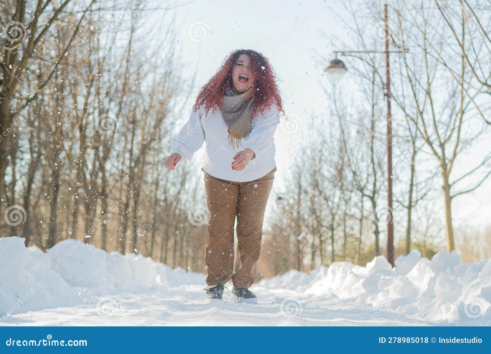 Smiling Chubby Redhead Woman Running in Park in Winter. Stock Photo ...