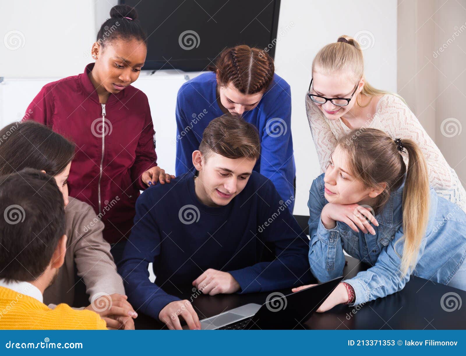 Smiling Classmates Having Difficult Project To Complete during Class ...