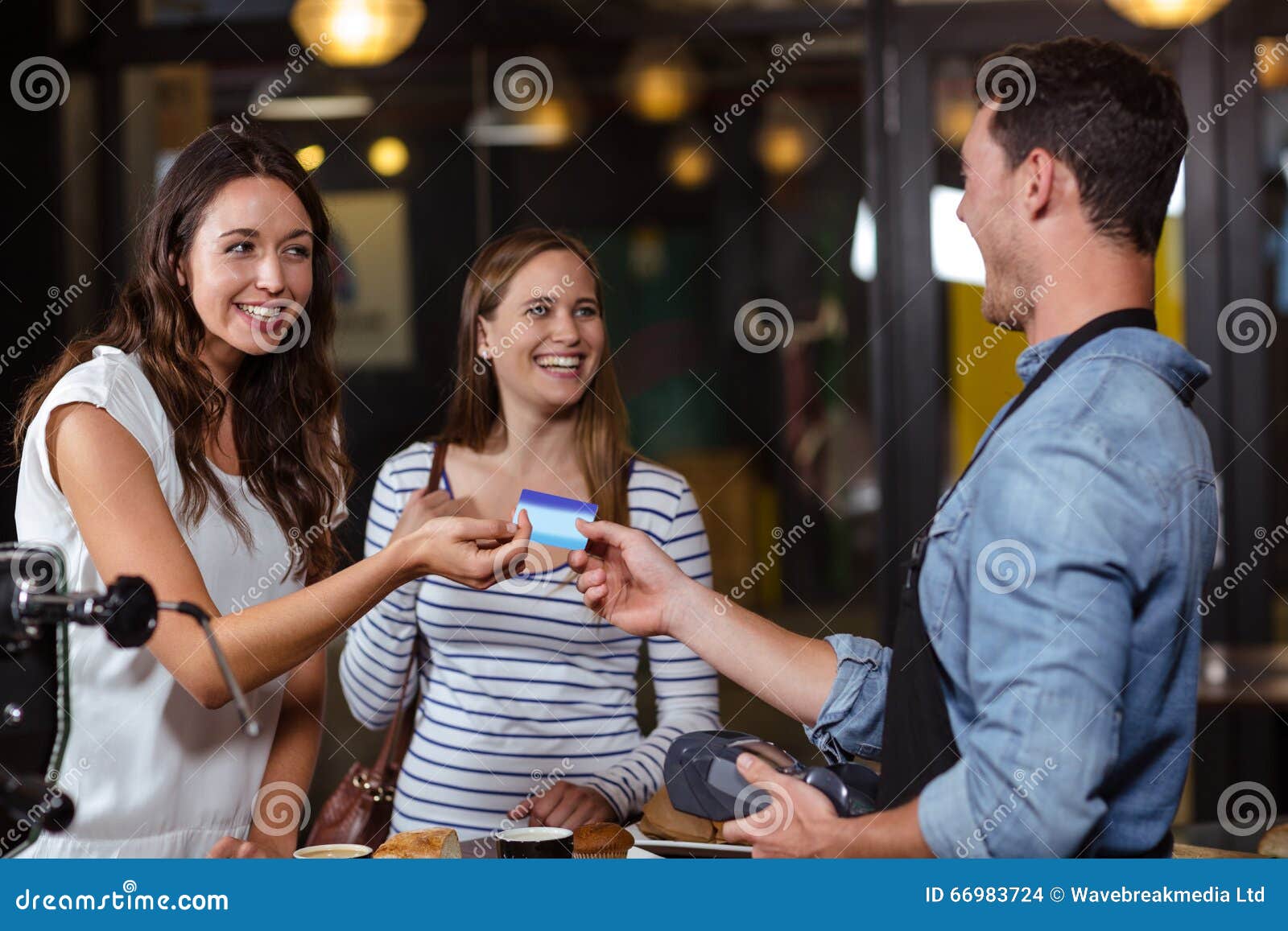 Smiling Clients Paying with Card Stock Photo - Image of communication ...