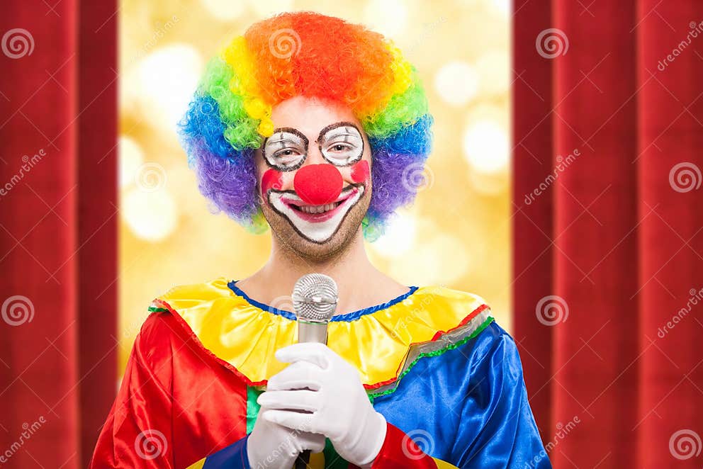 Smiling Clown Using a Microphone Stock Photo - Image of news, artist ...