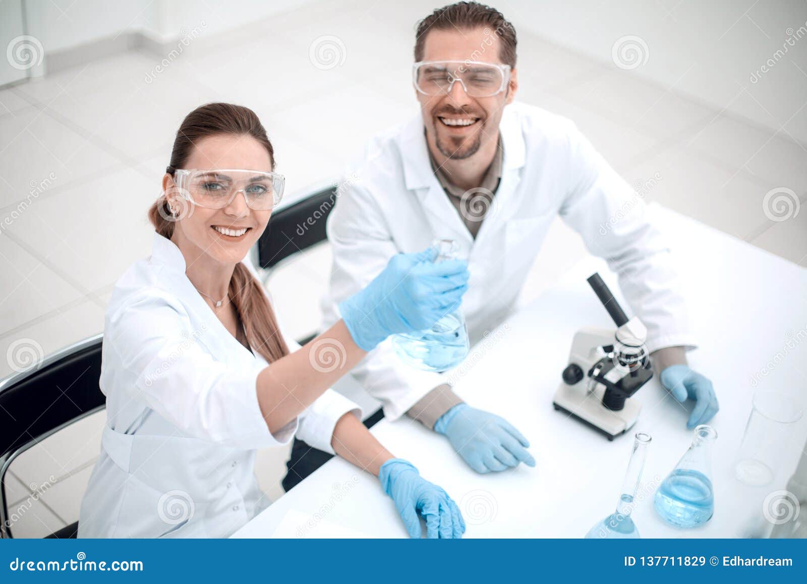 Smiling Colleagues Sitting at the Laboratory Table Stock Image - Image ...