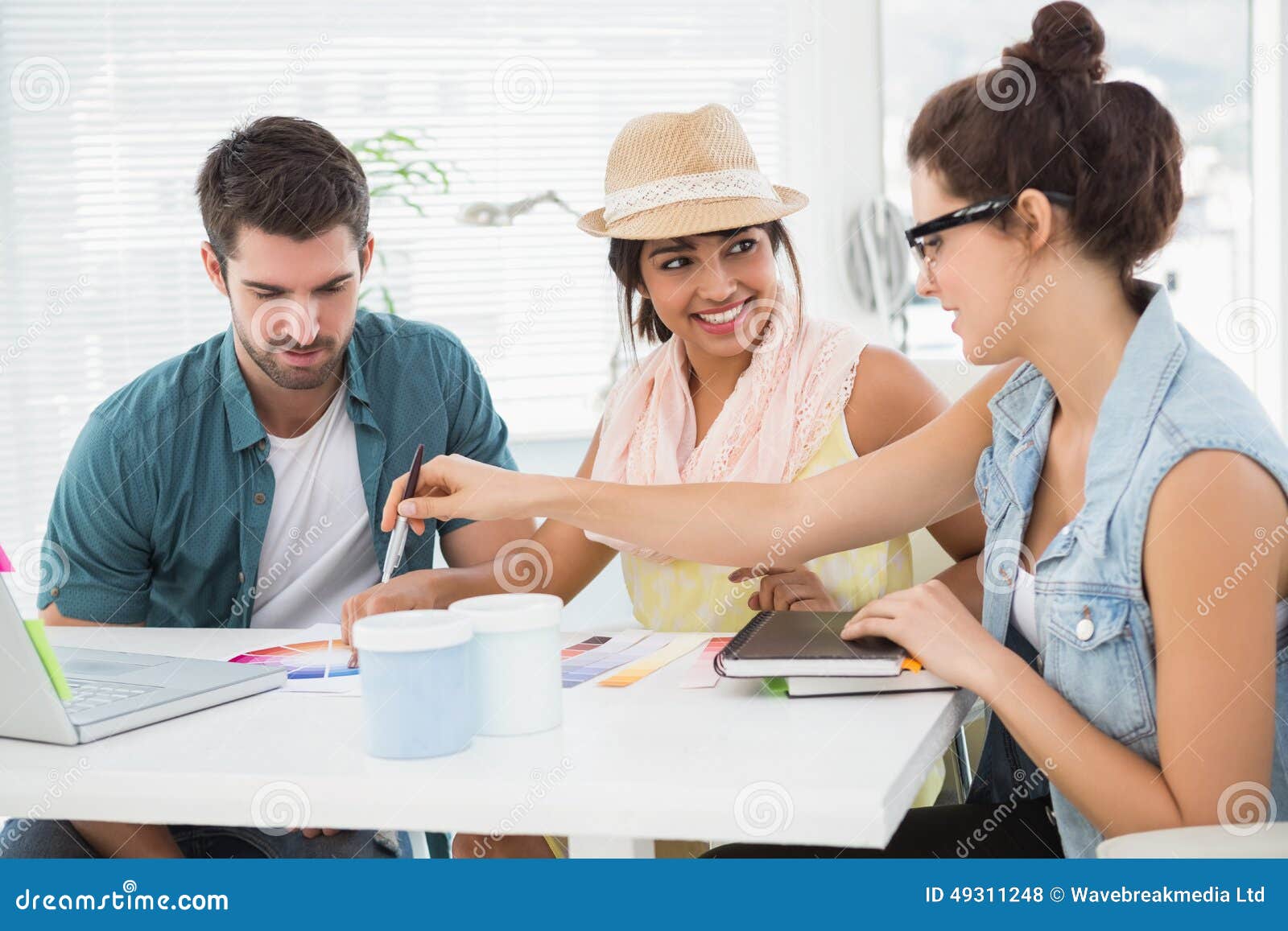 Smiling Colleagues Working Together with Colour Wheel Stock Photo ...
