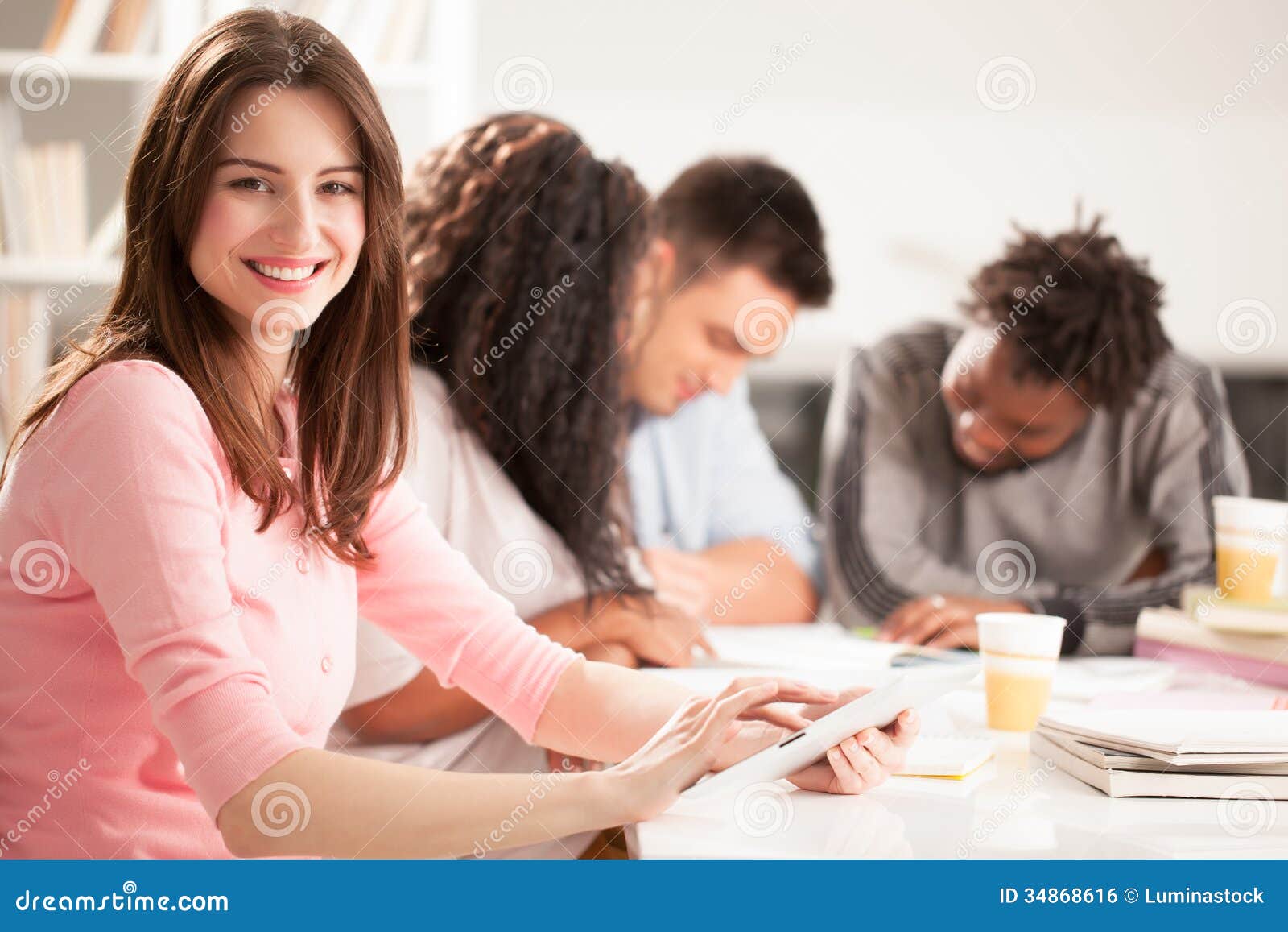 Smiling College Students Sitting Together Stock Photo - Image of ...