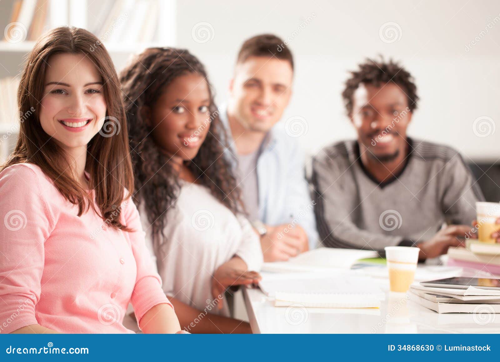 Smiling College Students Sitting Together Stock Photo - Image of ...