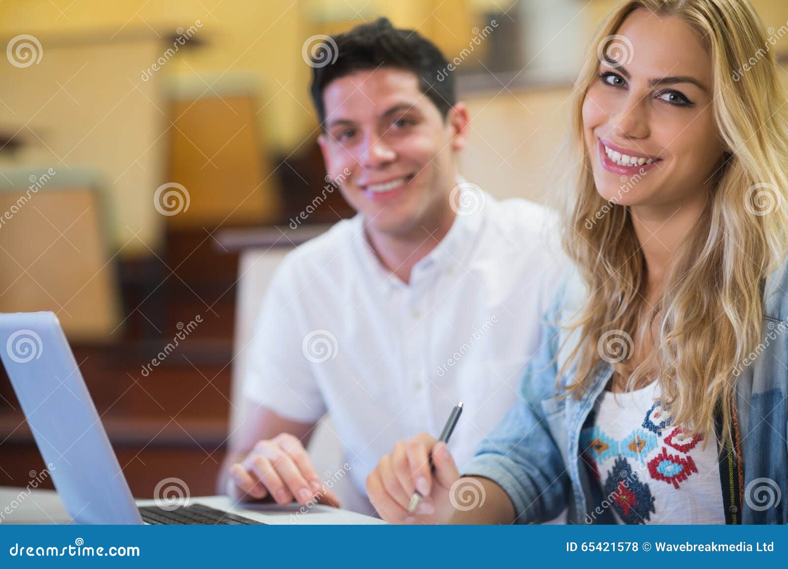 Smiling College Students Using Laptop Stock Photo - Image of casual ...