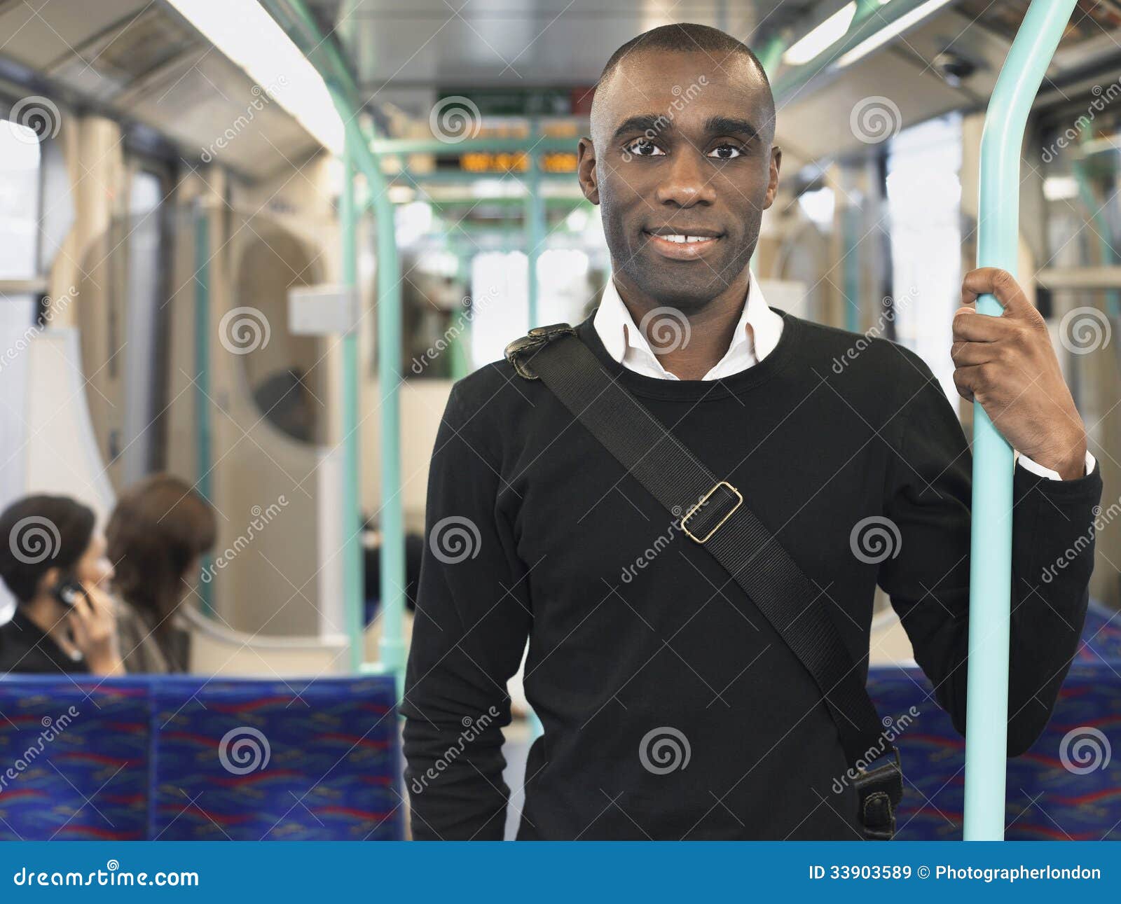 Smiling Commuter Standing in Train Stock Image - Image of fashion ...