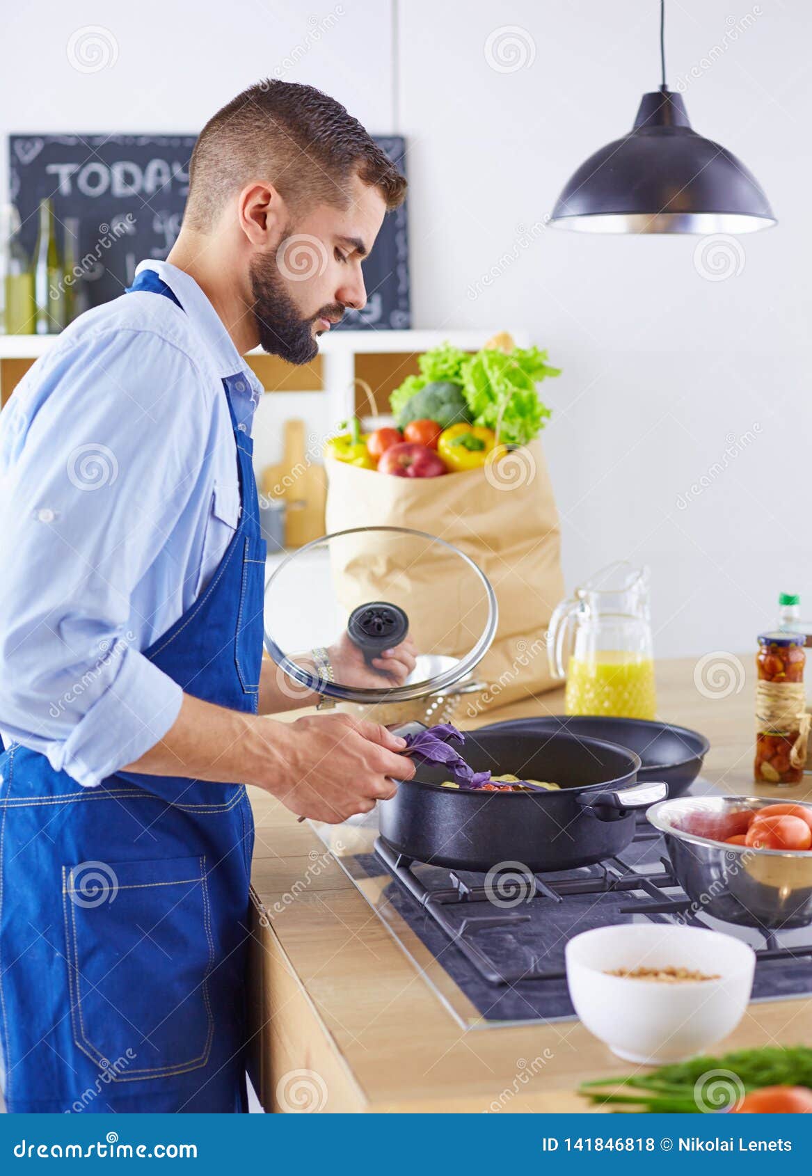 Smiling and Confident Chef Standing in Large Kitchen Stock Photo ...