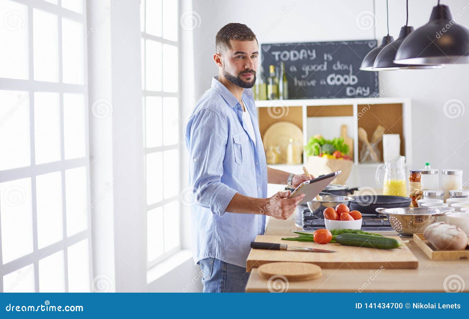 Smiling and Confident Chef Standing in Large Kitchen Stock Photo ...