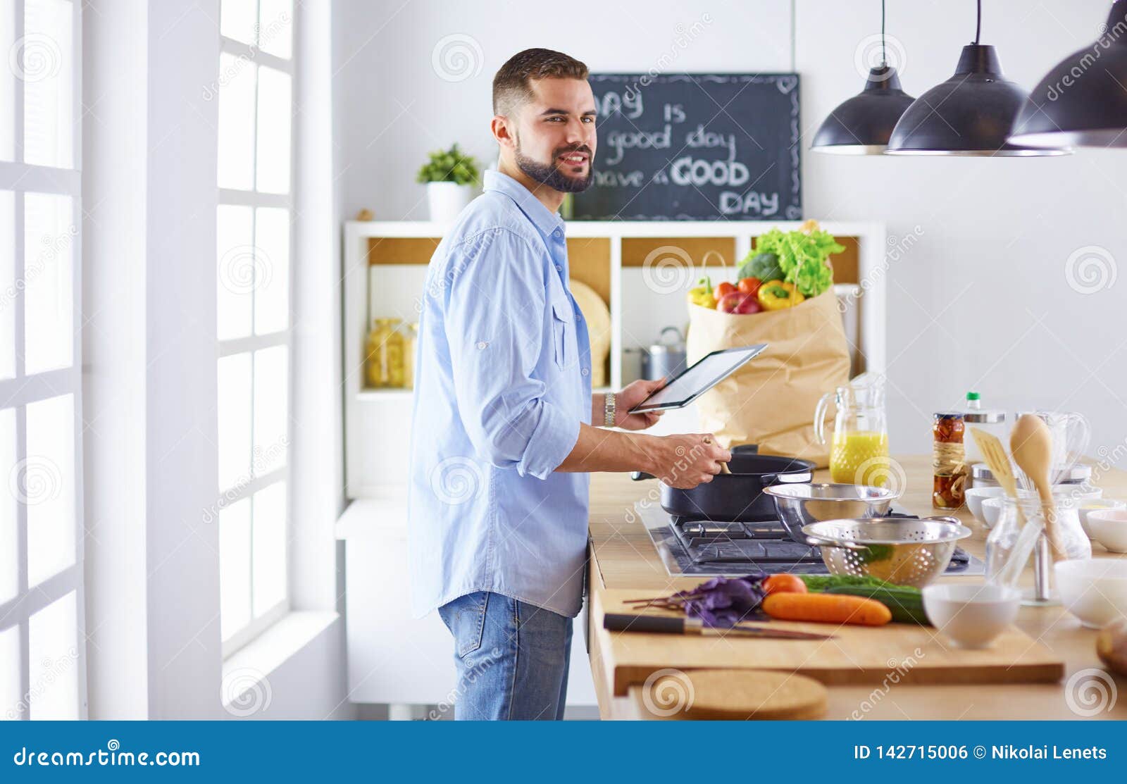Smiling and Confident Chef Standing in Large Kitchen Stock Photo ...