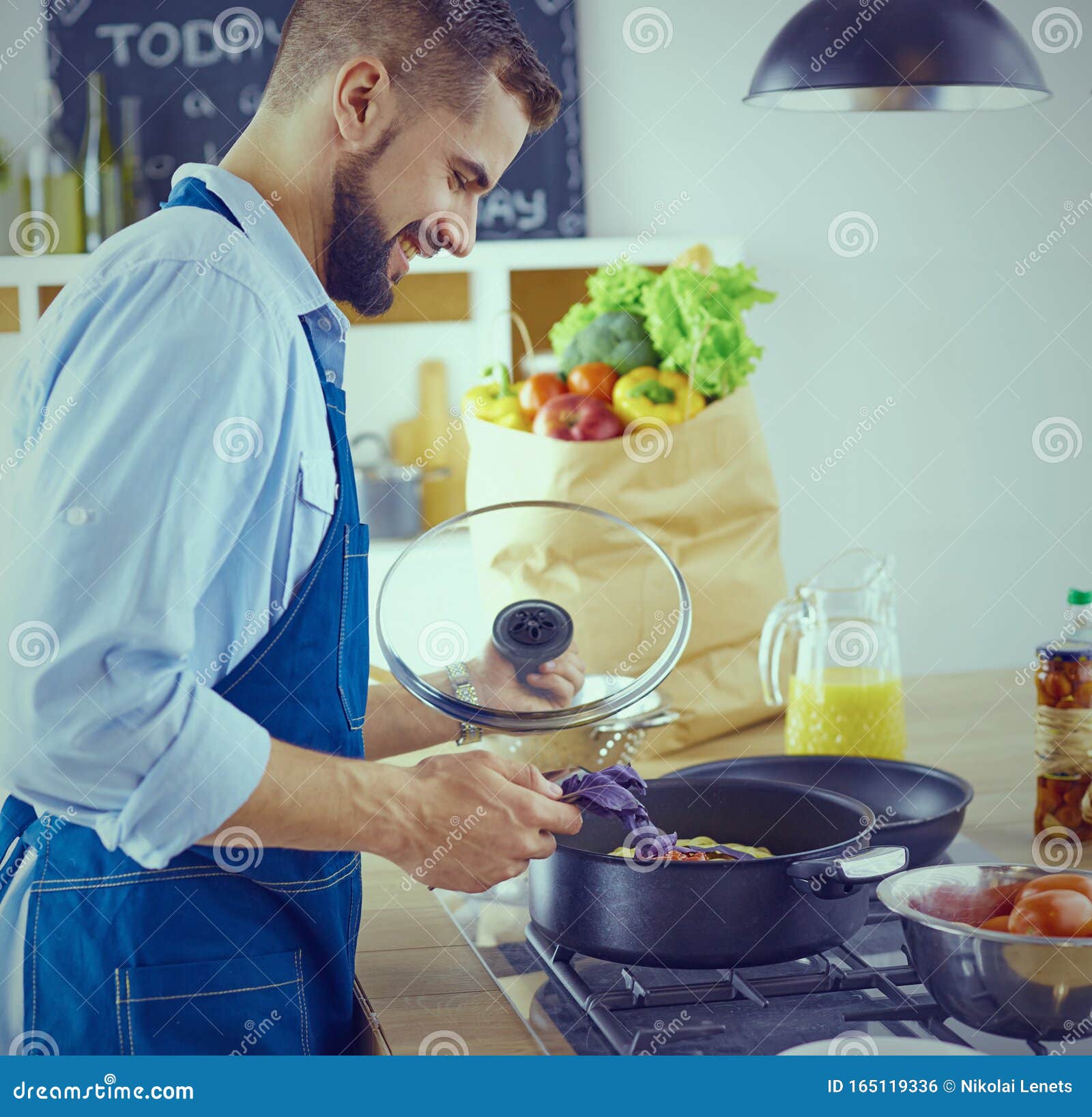 Smiling and Confident Chef Standing in Large Kitchen Stock Photo ...