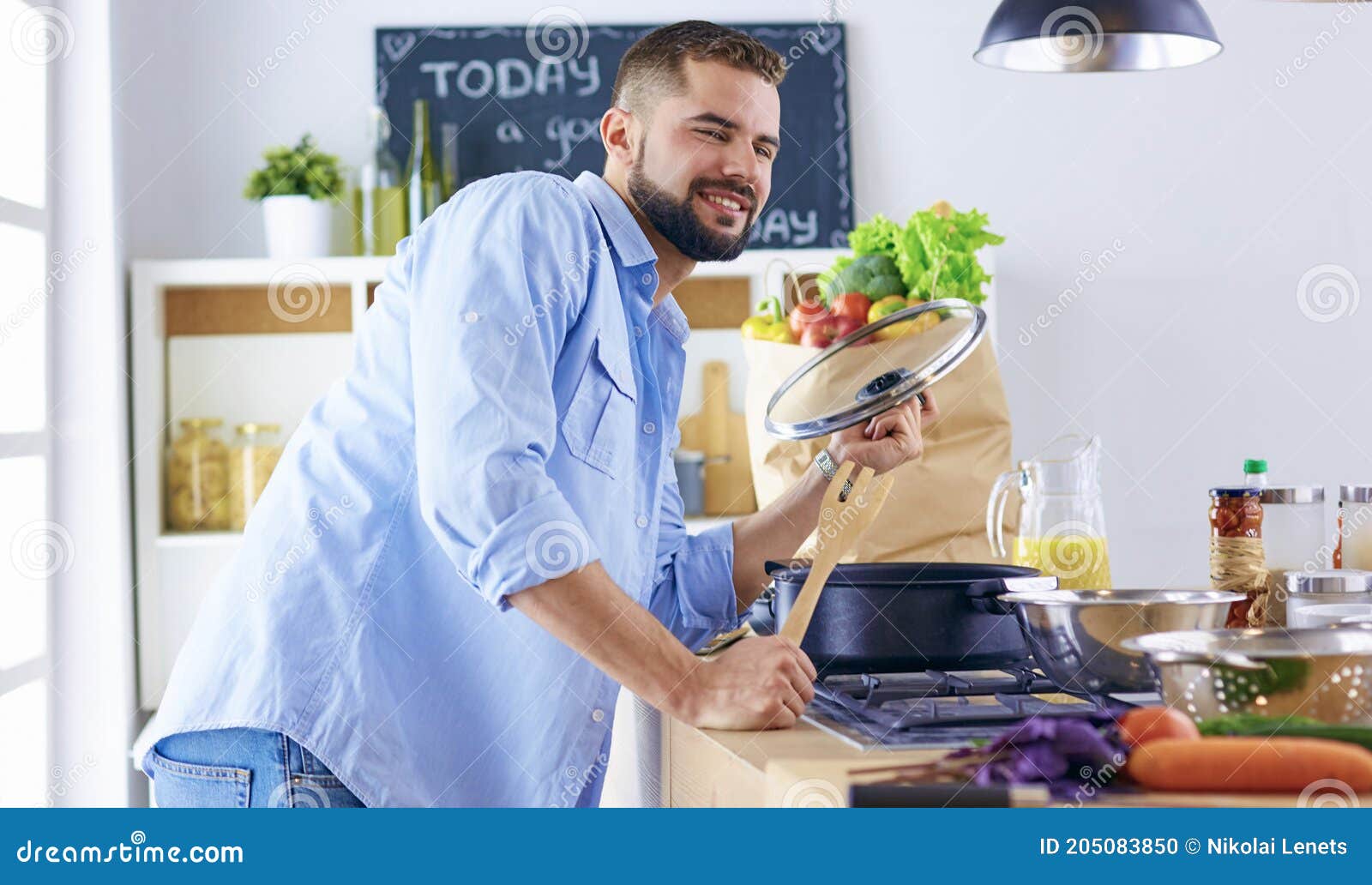 Smiling and Confident Chef Standing in Large Kitchen Stock Photo ...