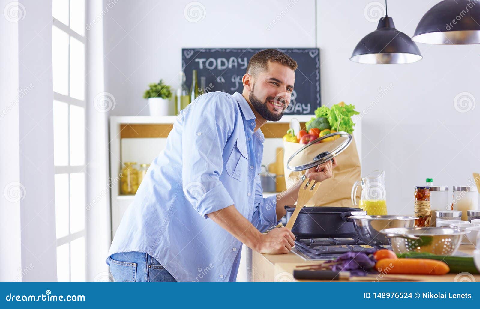 Smiling and Confident Chef Standing in a Large Kitchen Tasting Stock ...