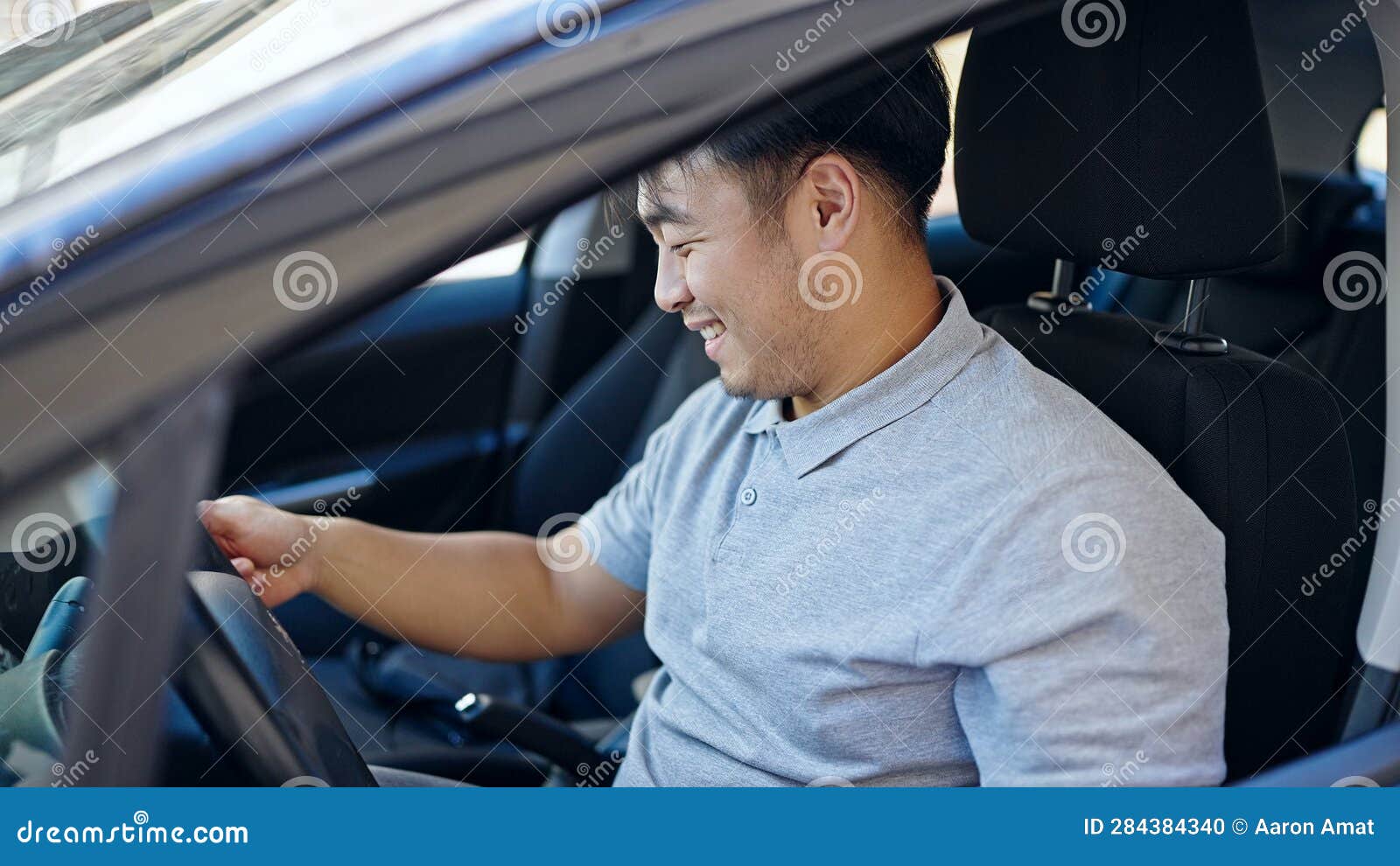 Smiling Confident Driving Car at Street Stock Photo - Image of driving ...