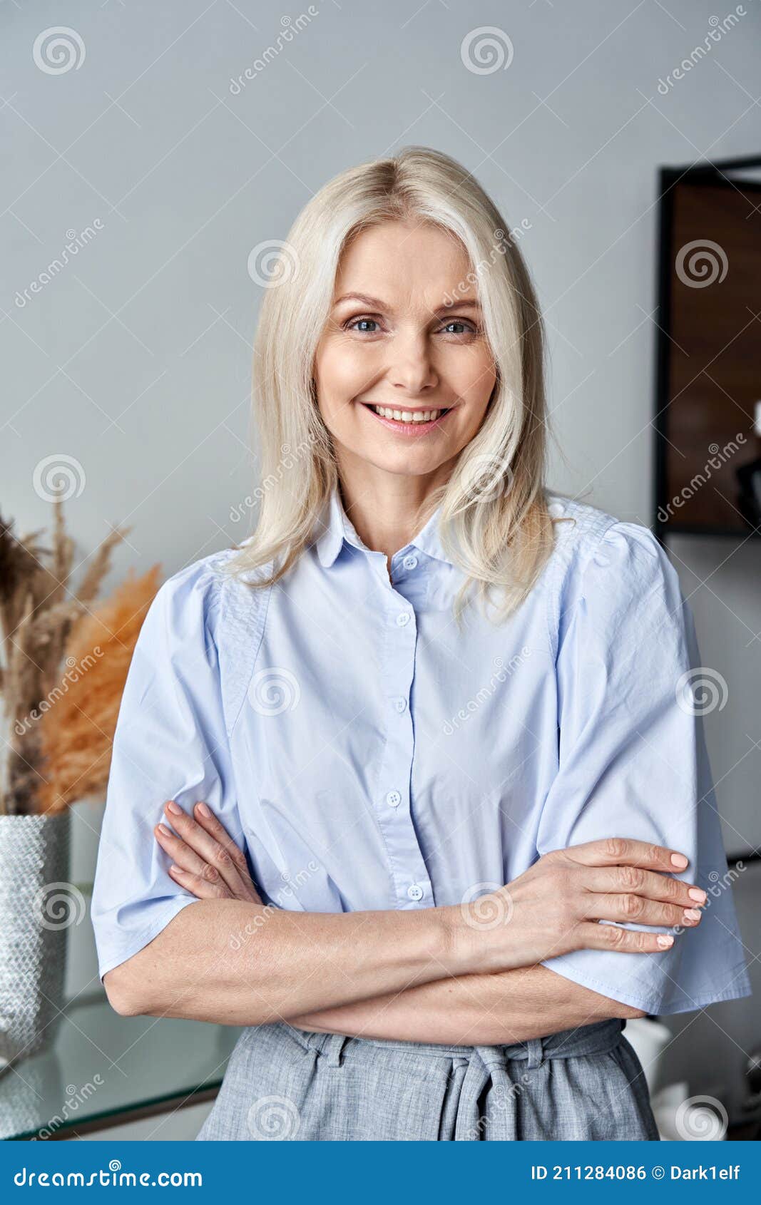 Smiling Confident 50s Middle Aged Woman Standing Arms Crossed at Home ... Smiling Confident 50s Middle Aged Woman Standing Arms Crossed at Home ...