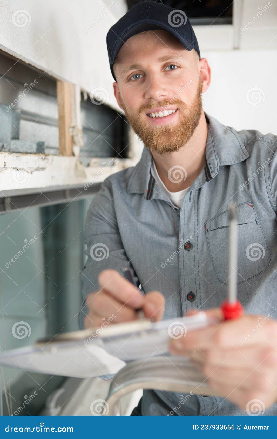 A Smiling Construction Inspector Stock Photo - Image of adult, indoors ...