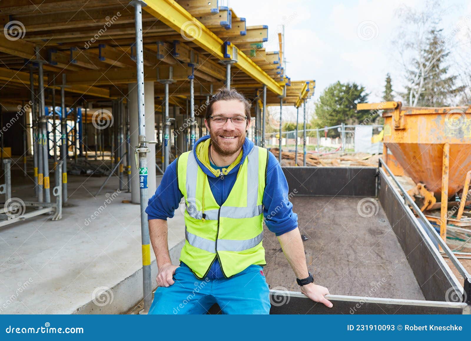 Smiling Construction Worker Apprentice on a Construction Site Stock ...