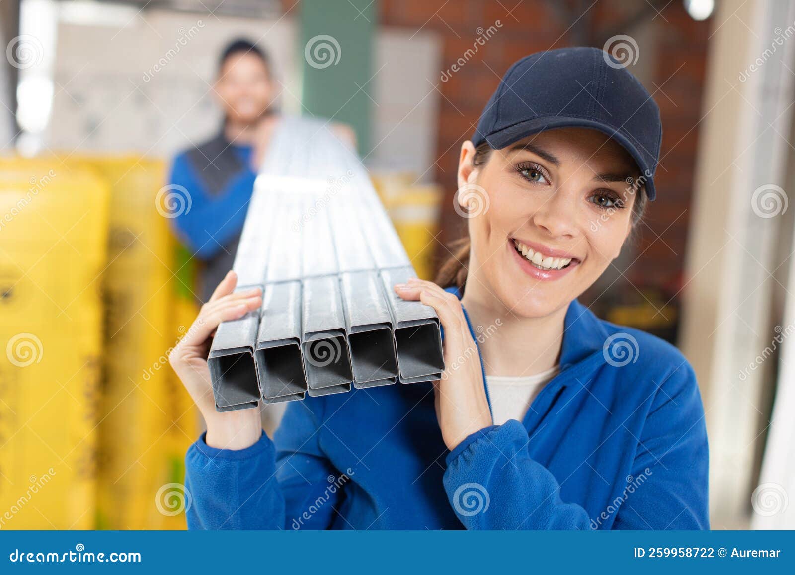 Smiling Construction Worker Carrying Metal Bar Stock Photo - Image of ...