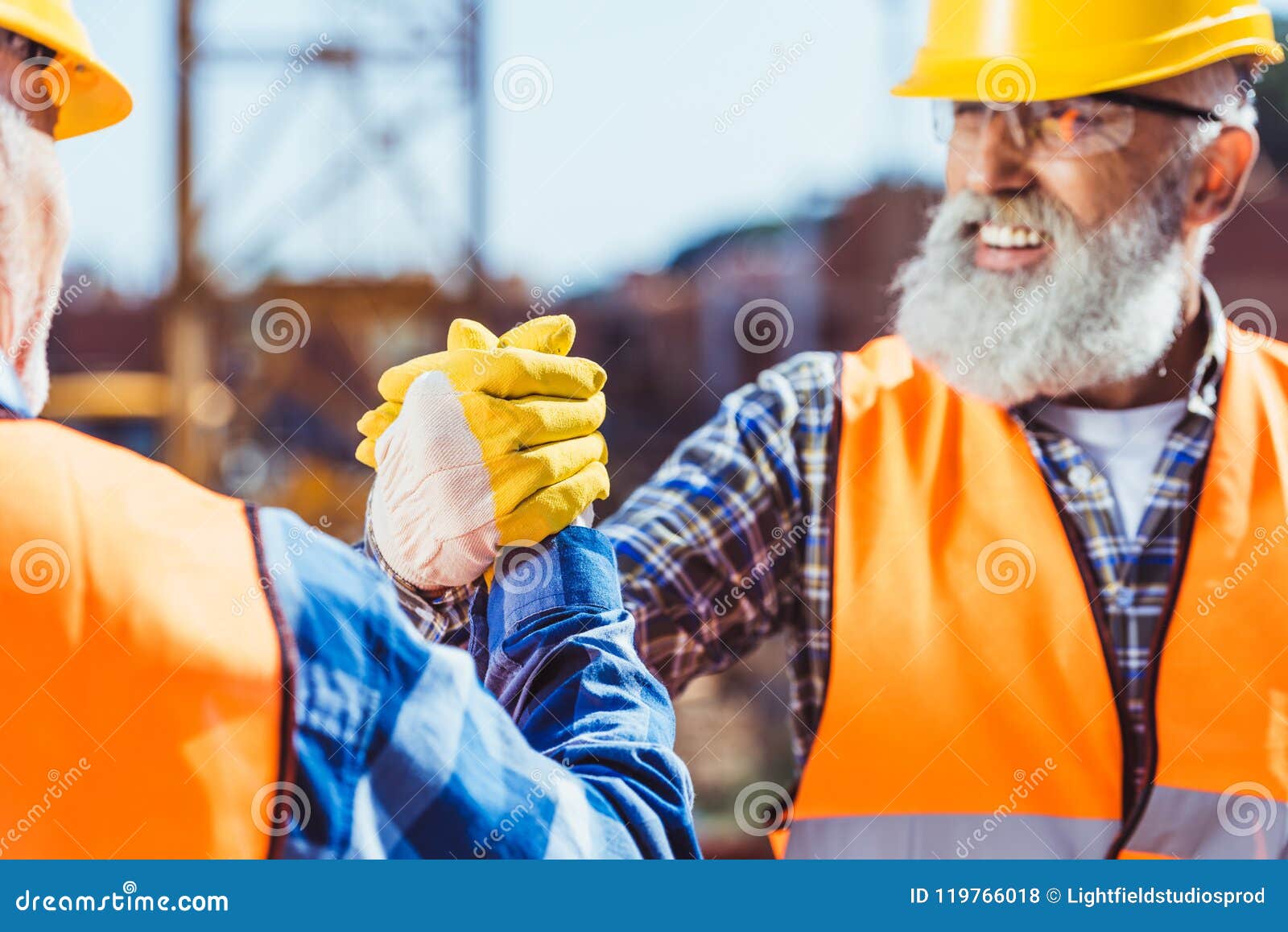 Smiling Construction Worker in Protective Uniform Shaking Hands Stock ...