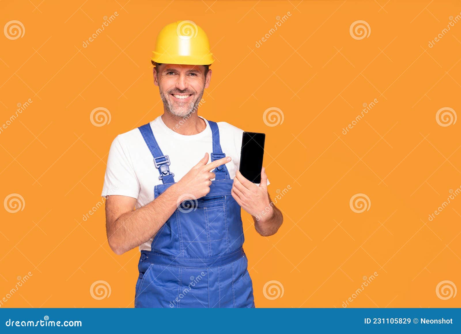 Smiling Construction Worker Showing Cellphone Empty Screen To the ...