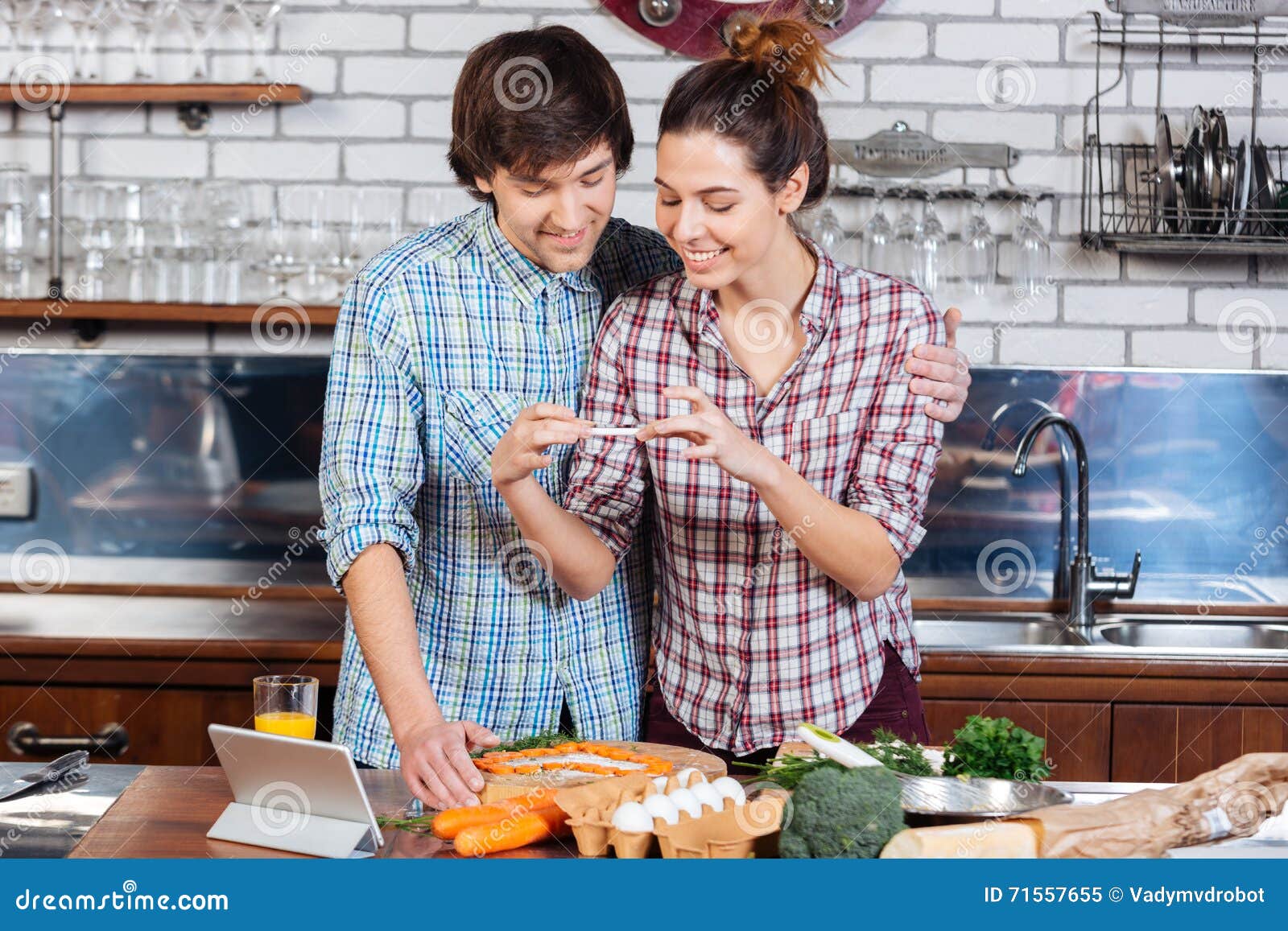Smiling Cooking and Taking Photos with Smartphone on the Kitchen Stock ...