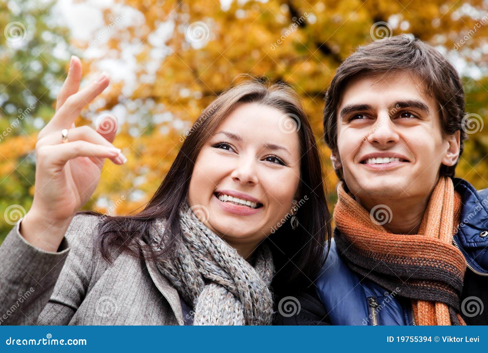 Smiling Couple Autumn Pointing Stock Photo - Image of pointing ...