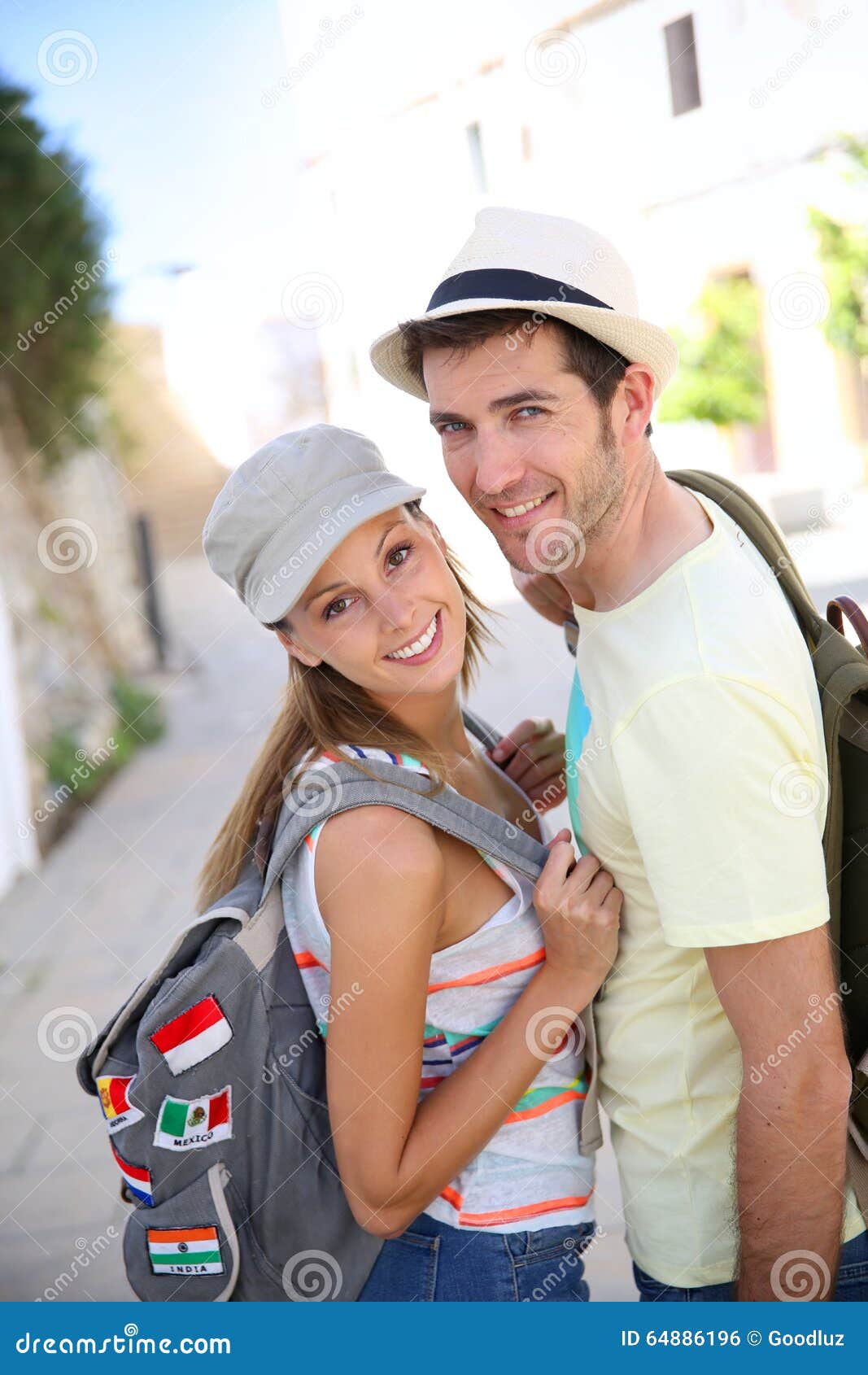 Smiling Couple of Backpackers Visiting Old Town Stock Photo - Image of ...
