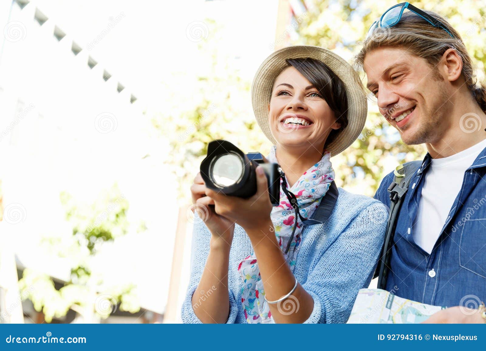 Smiling Couple with the Camera Stock Photo - Image of equipment ...