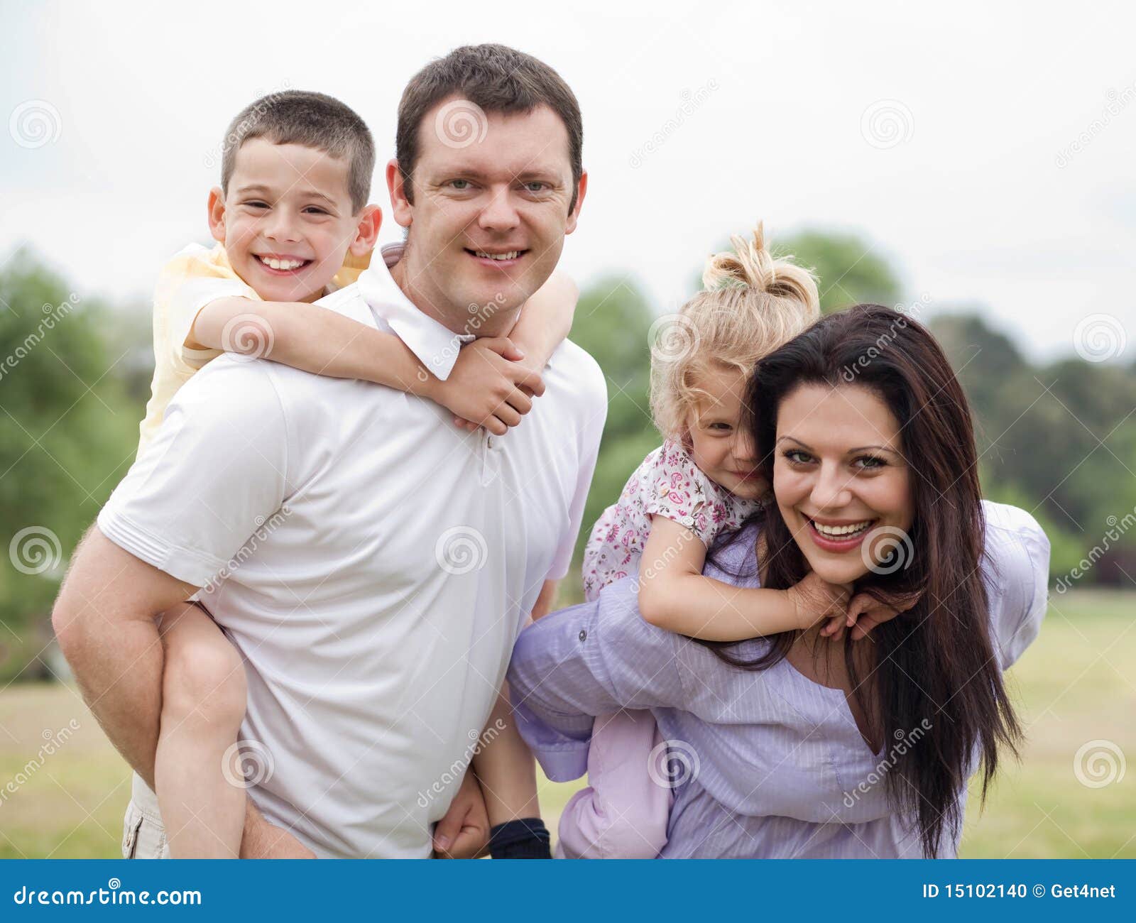 Smiling Couple Carrying Kids on Their Back Stock Photo - Image of ...