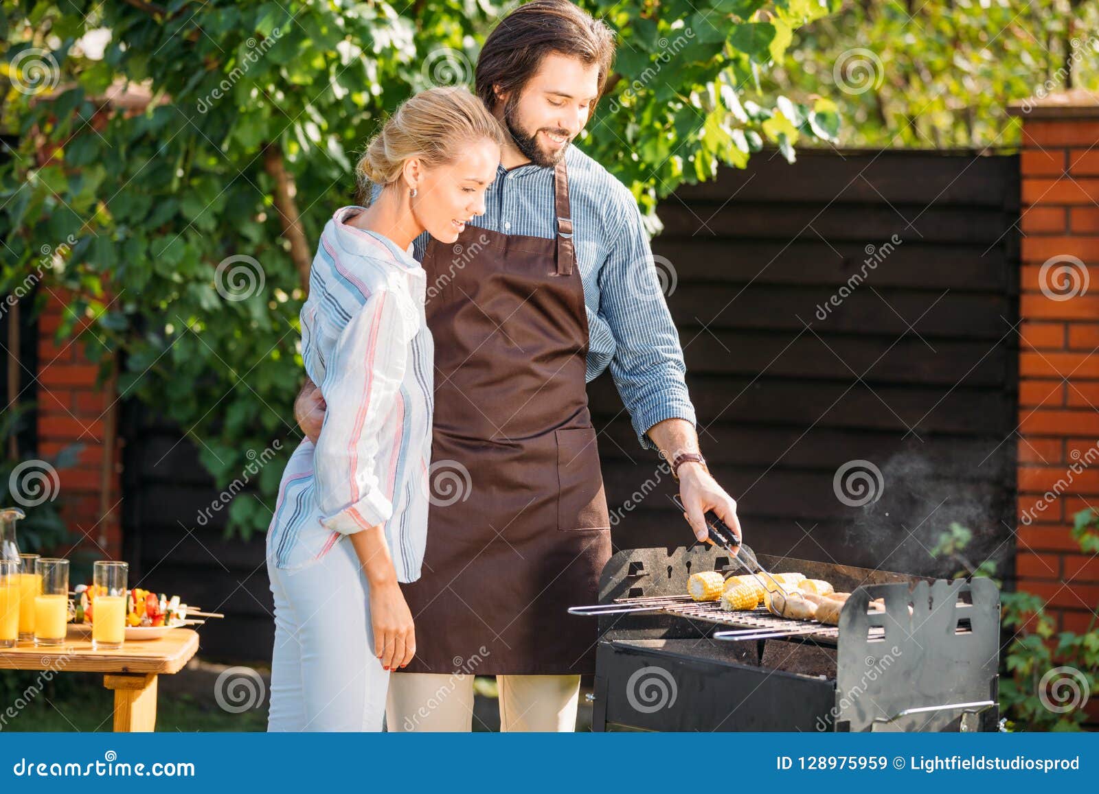 Smiling Couple Having Barbecue on Backyard Stock Image - Image of ...