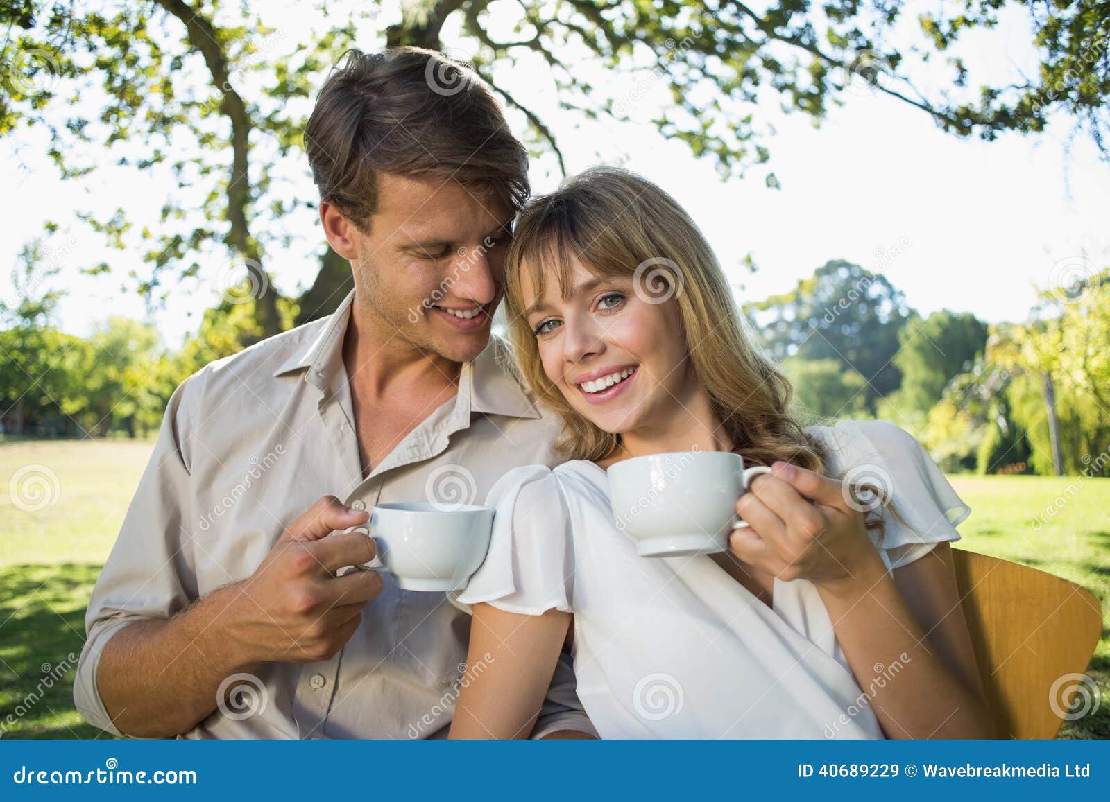 Smiling Couple Having Tea Outside in a Cafe Stock Image - Image of ...
