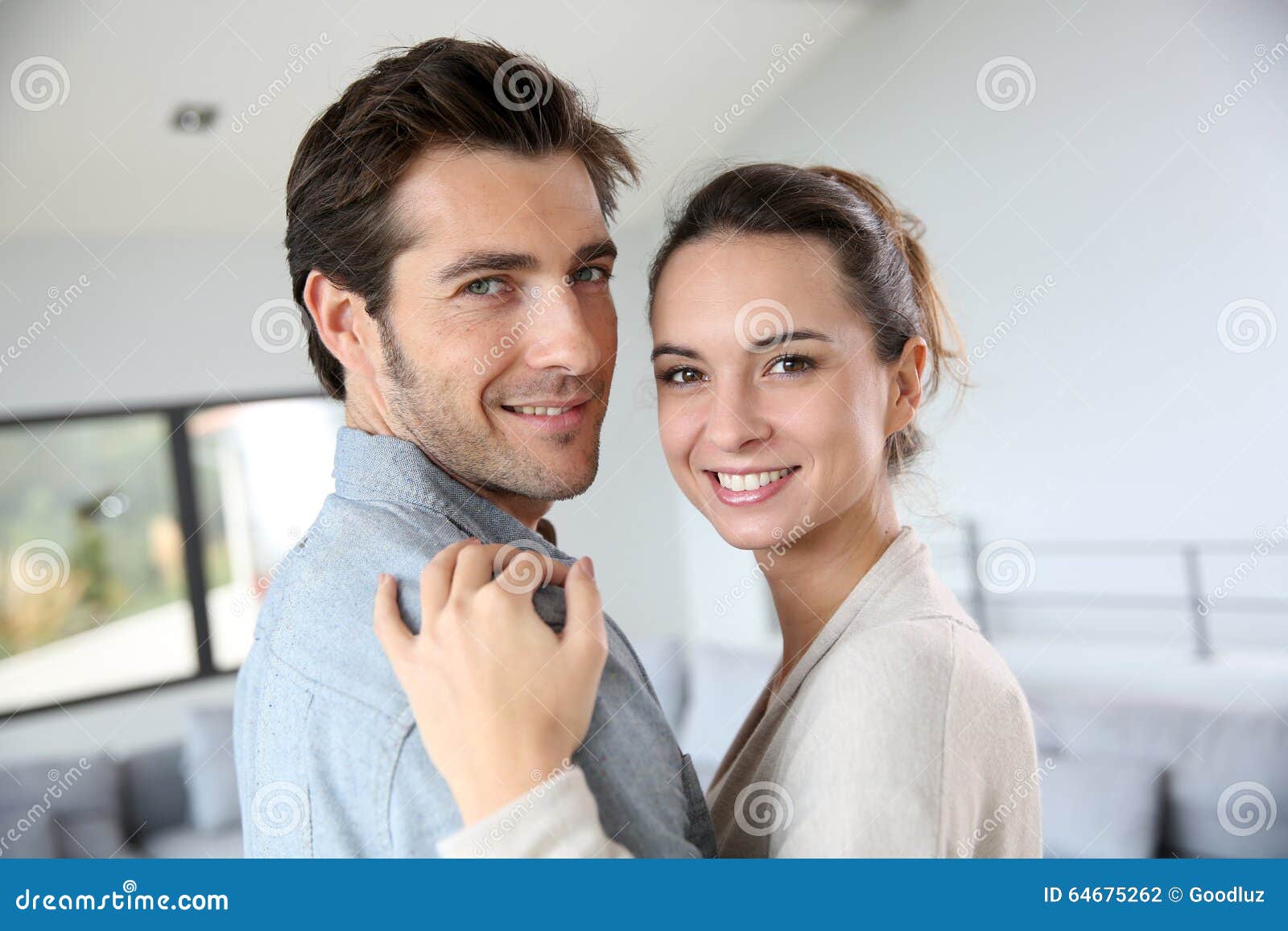 Smiling couple at home stock photo. Image of adults, property - 64675262