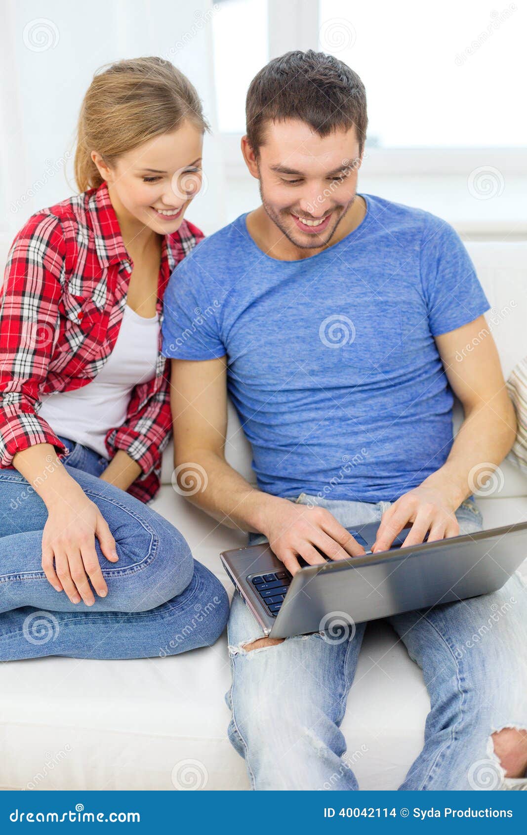 Smiling Couple with Laptop Computer at Home Stock Photo - Image of ...